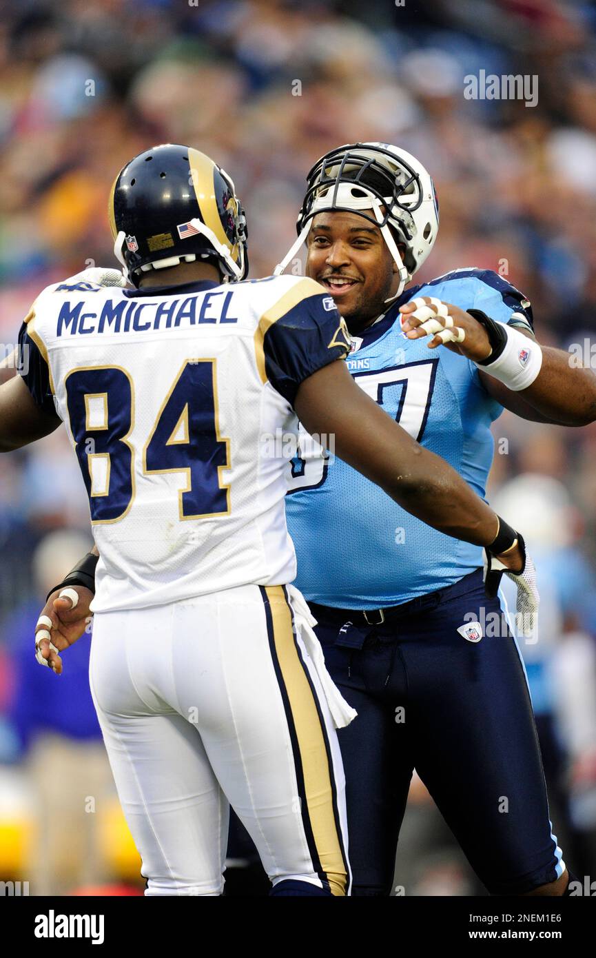 Tennessee Titans defensive tackle Tony Brown (97) embraces St. Louis ...