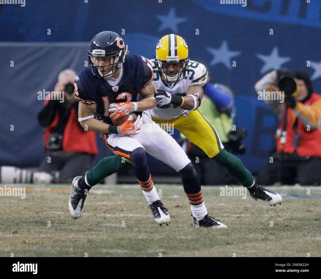 Chicago Bears quarterback Caleb Hanie (12) is pursued by Green Bay ...