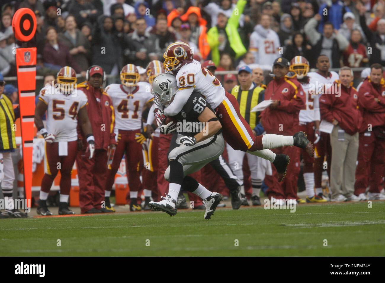 Oakland Raiders tight end Zach Miller (80) is tackled by Washington ...
