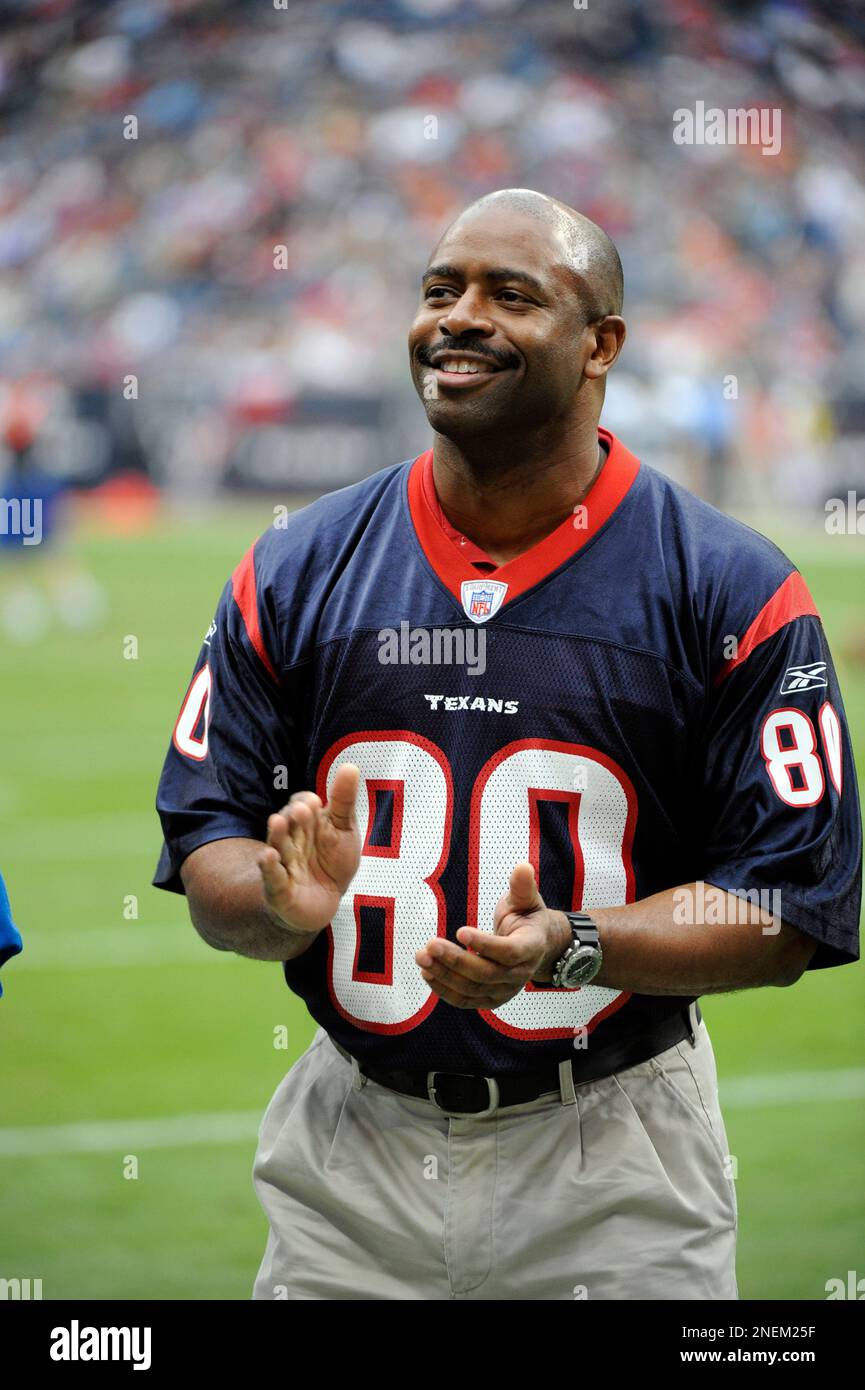 Space shuttle astronaut Leland Melvin wears an Andre Johnson jersey he ...