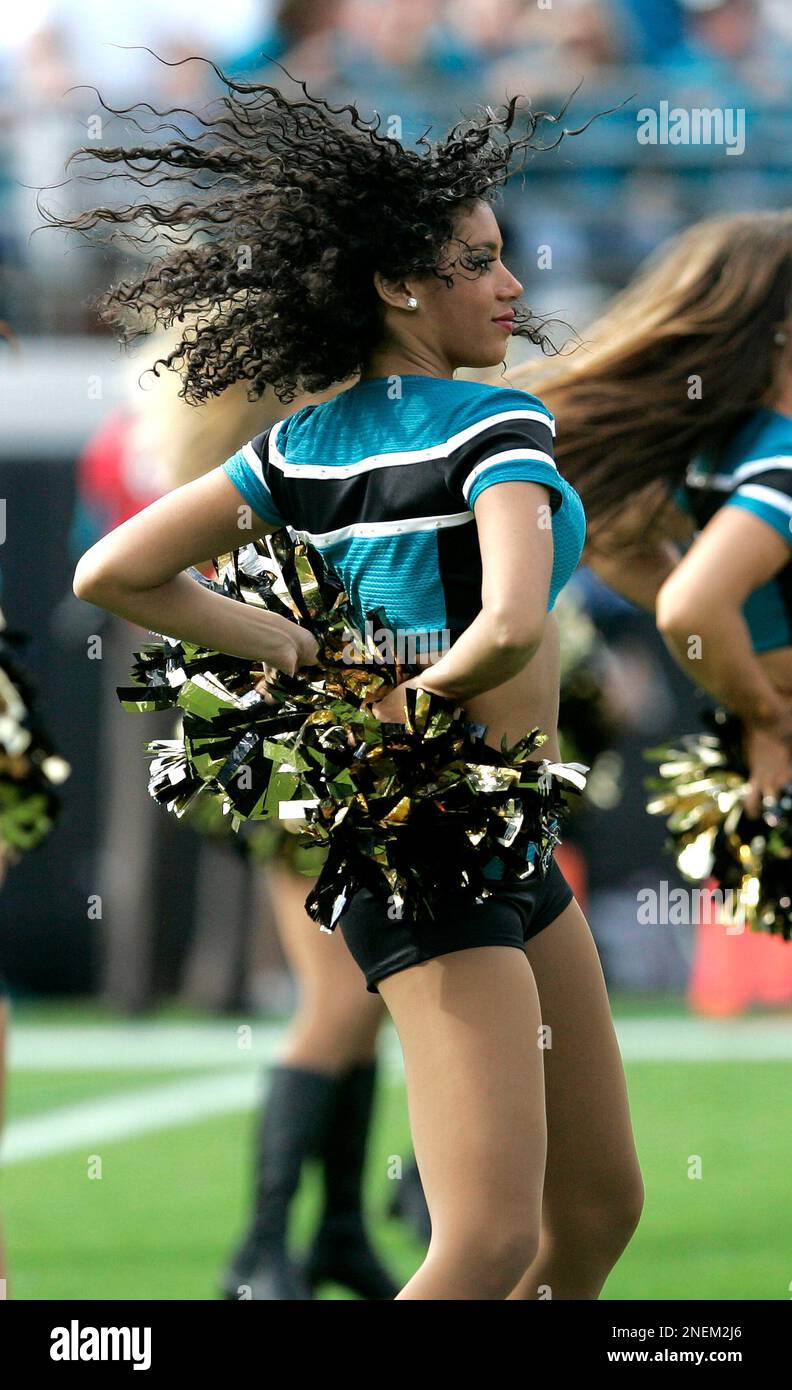 A Jacksonville Jaguars cheerleader performs during a NFL football game ...