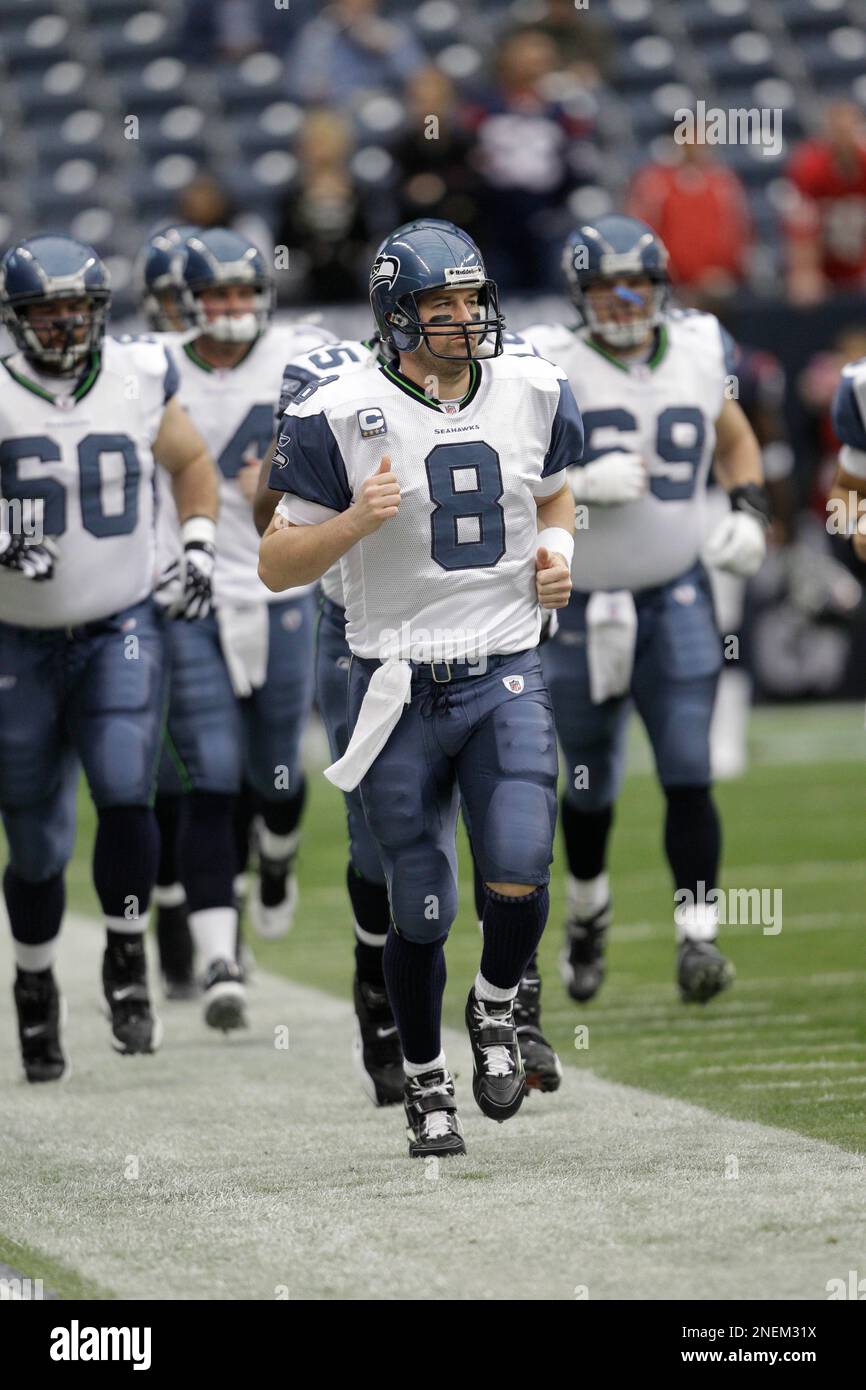 Houston Texans quarterback Matt Schaub (8) leads the team onto the ...