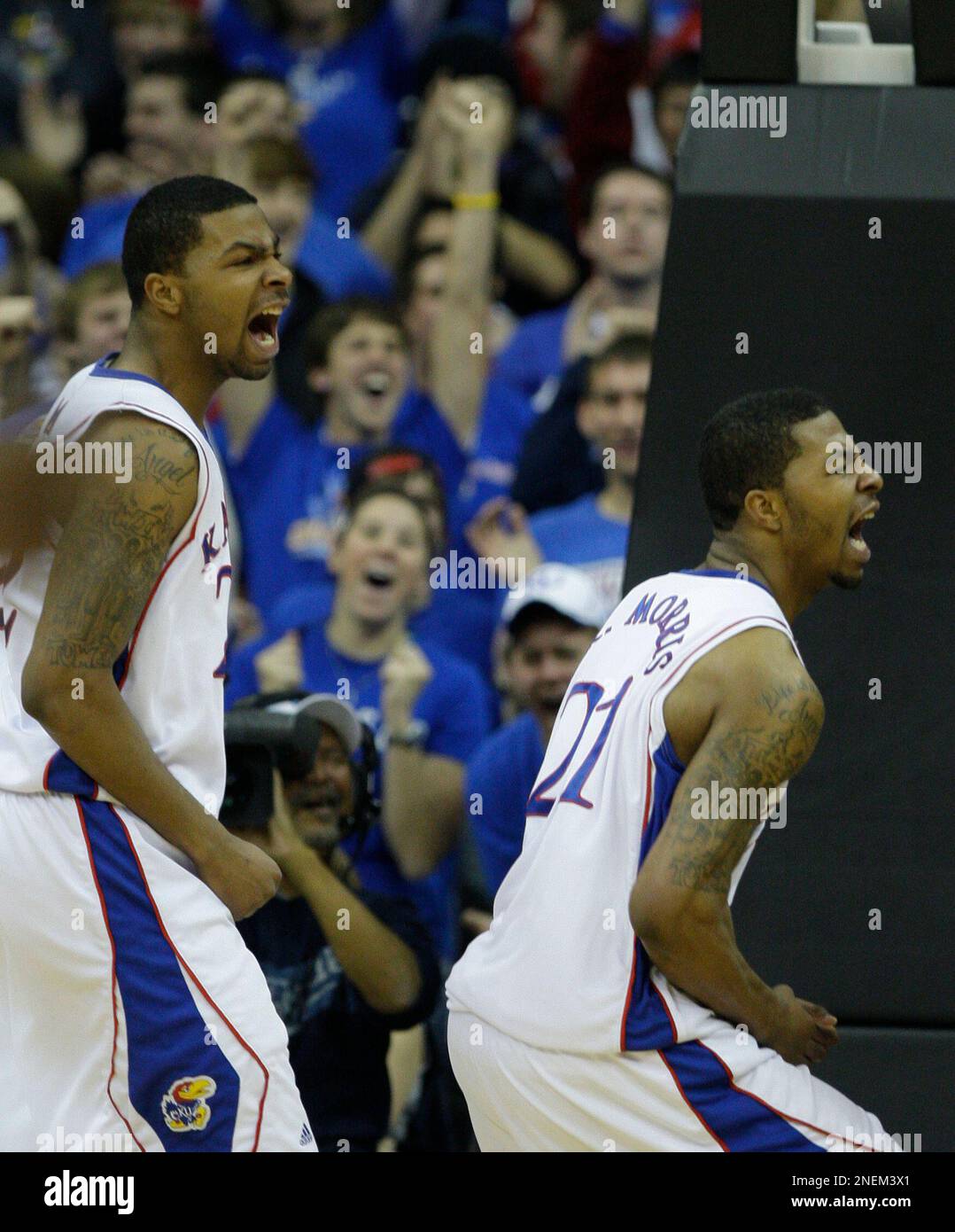 Kansas' Markieff Morris (21) with his twin brother Marcus Morris, left ...
