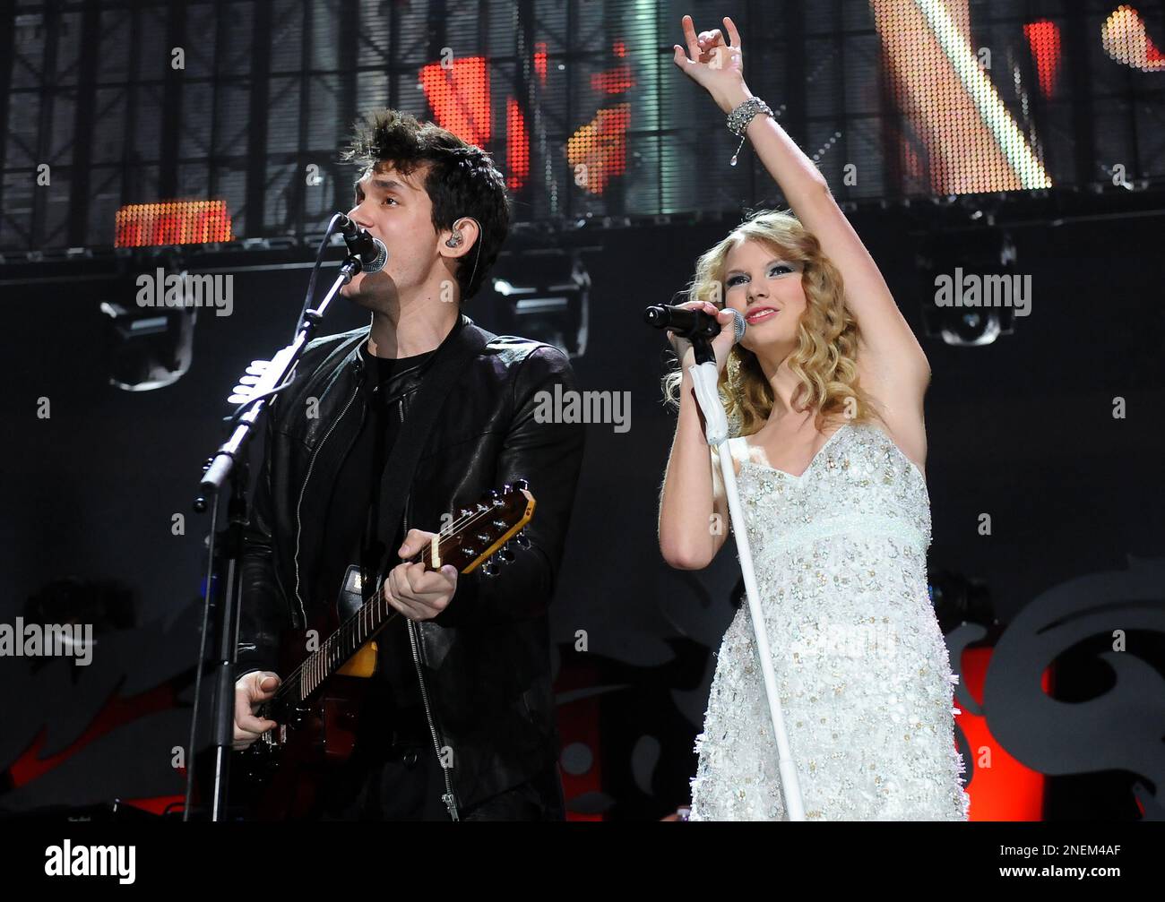 Musician John Mayer and singer Taylor Swift perform together at the ...