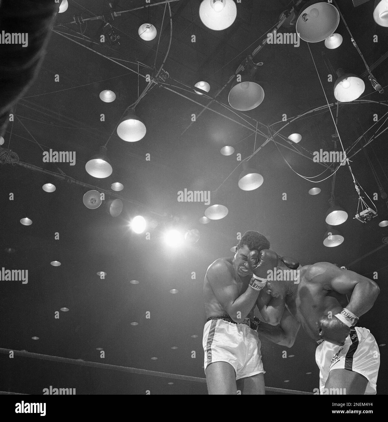 Sonny Liston, right, lowers his head and works in close during 6th ...
