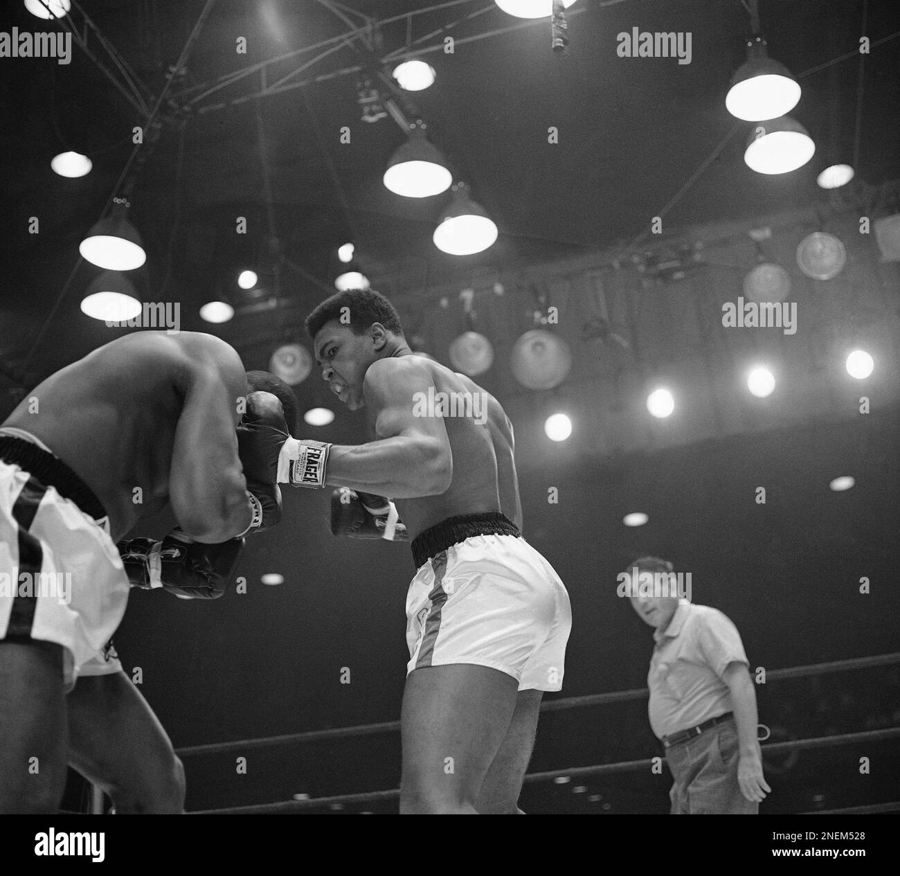 Sonny Liston, right, lowers his head and works in close during 6th ...