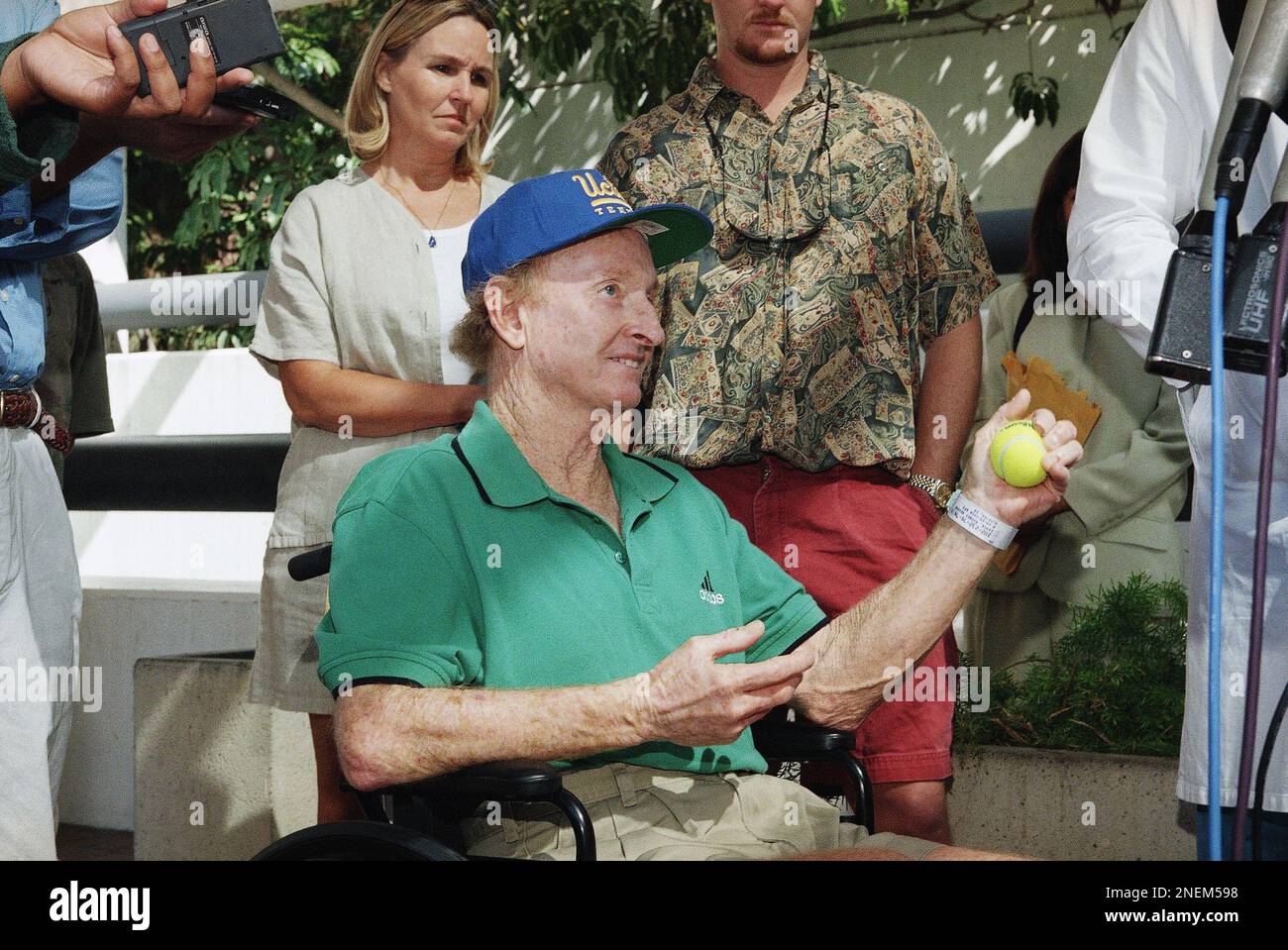 Rod Laver squeezes a tennis ball to demonstrate his regained strength ...