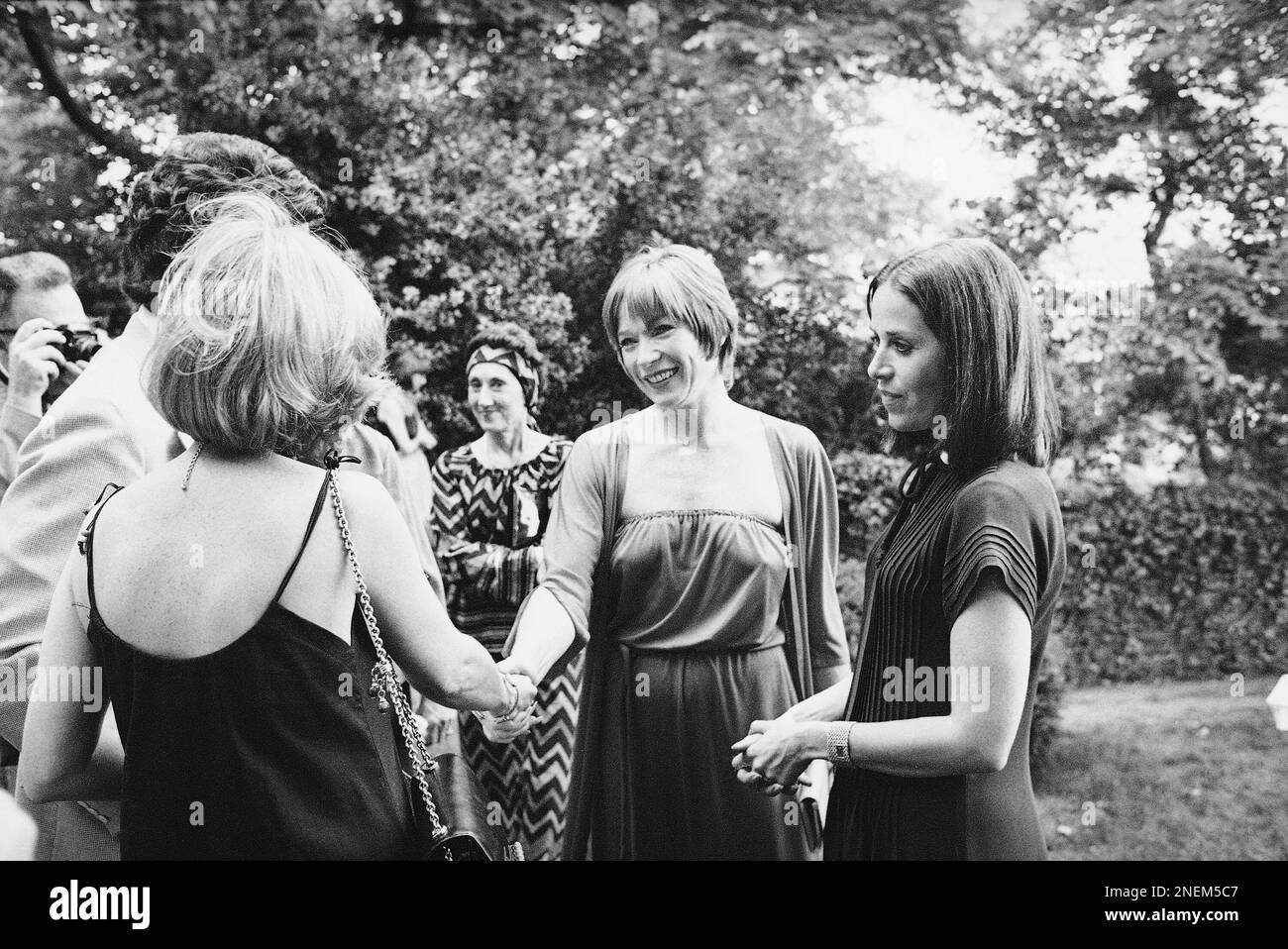 Actress Shirley MacLaine, center, is introduced to guests by Mrs. Smith ...