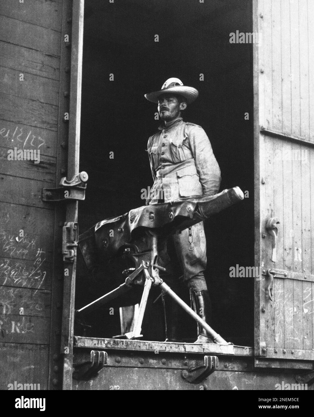 Mexican rebel machine gun, mounted in a box car door on a troop train ...