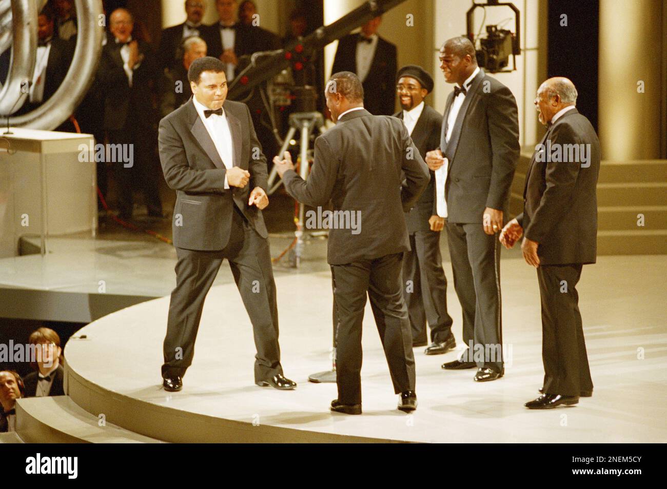 Boxing legend Muhammad Ali postures for a punch in jest with former ...
