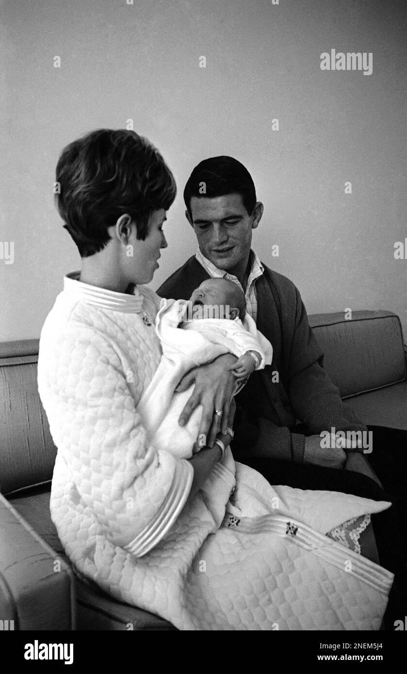 Michael Leon Reeves, age 4-days, has the full attention of his parents ...