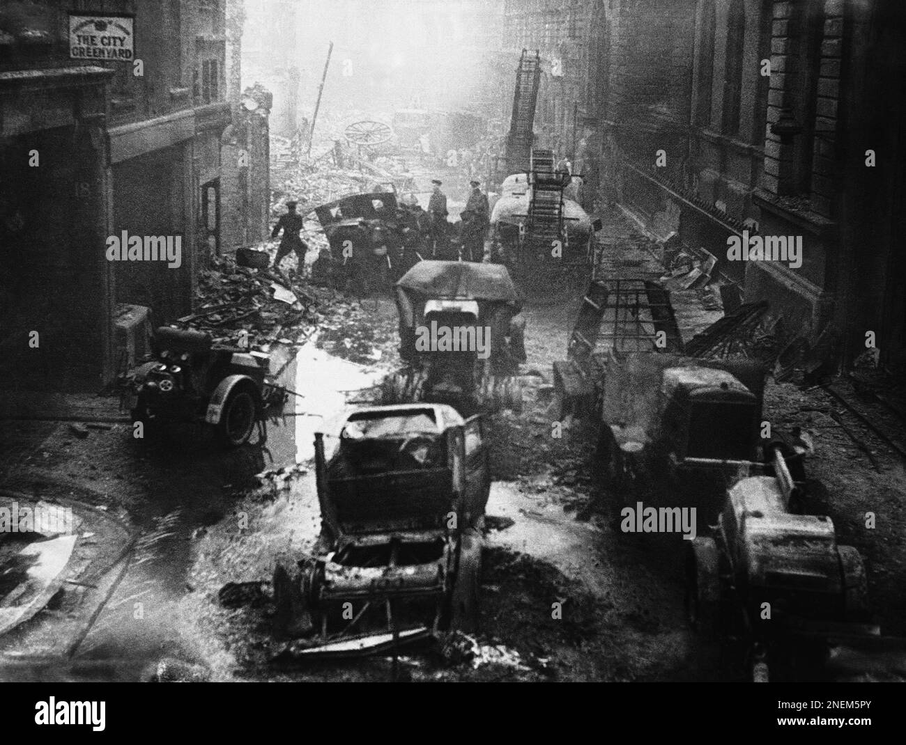 Fire engines caught in a circle of blazing buildings and abandoned ...