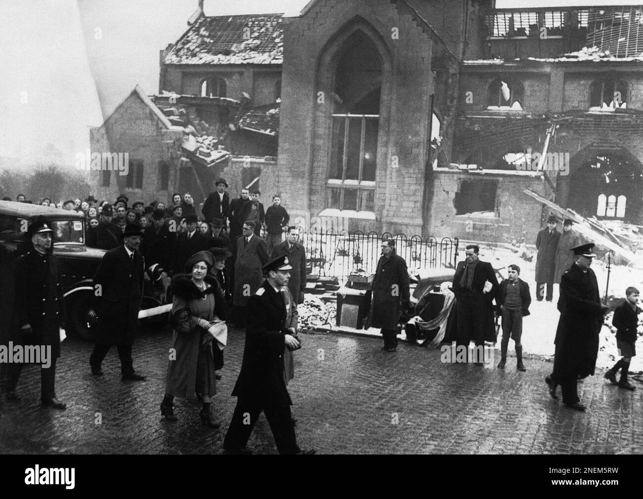 Britain's King George VI and Queen Elizabeth walking through the wet ...
