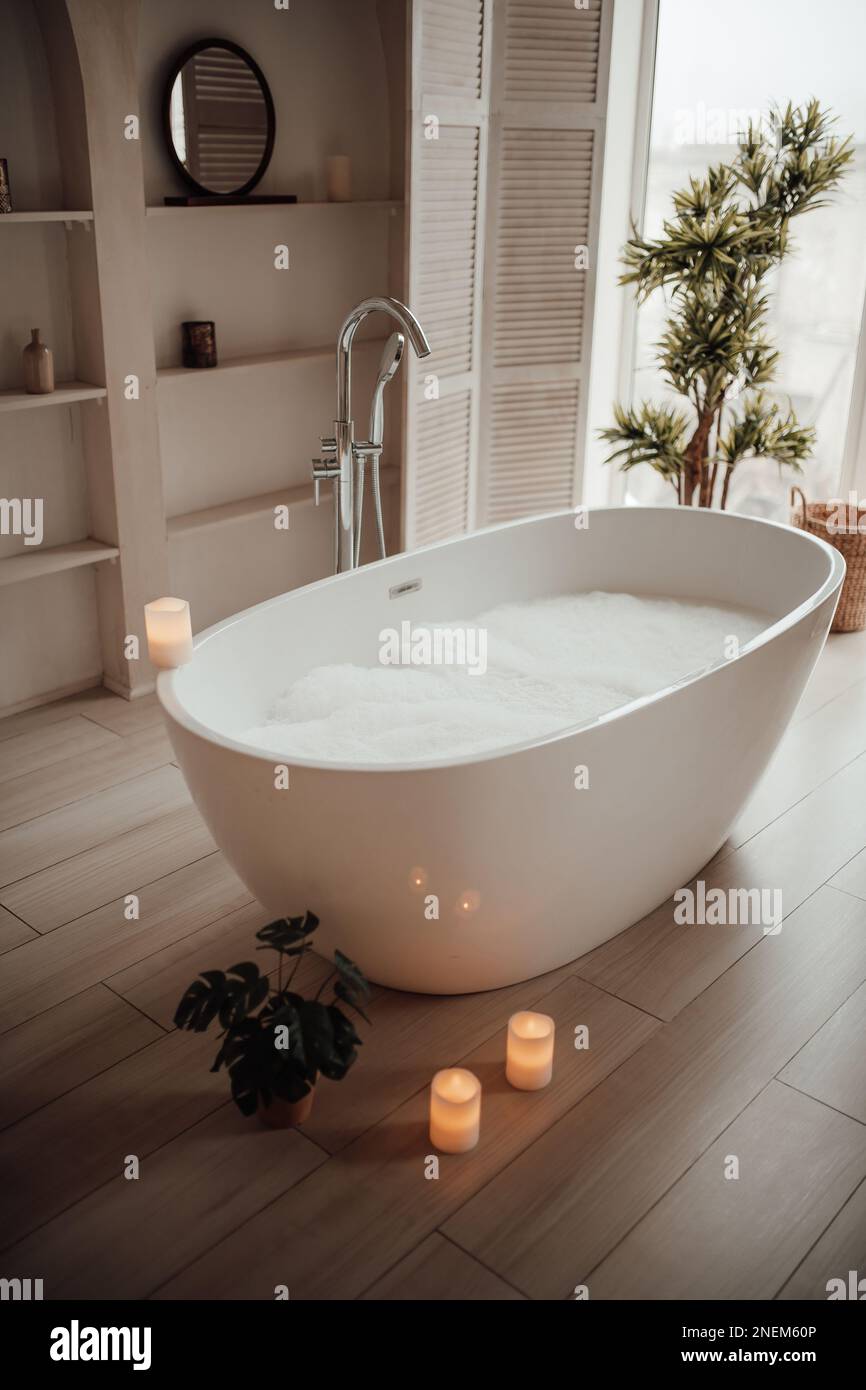 Soft native hues organic shapes look of bathroom with big window oval ...