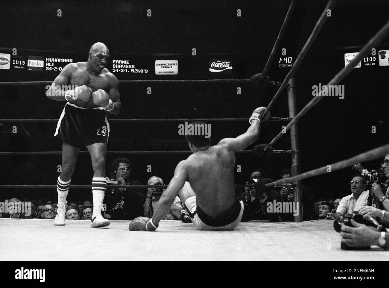 Heavyweight champion Muhammad Ali slips to the canvas in the fourteenth ...