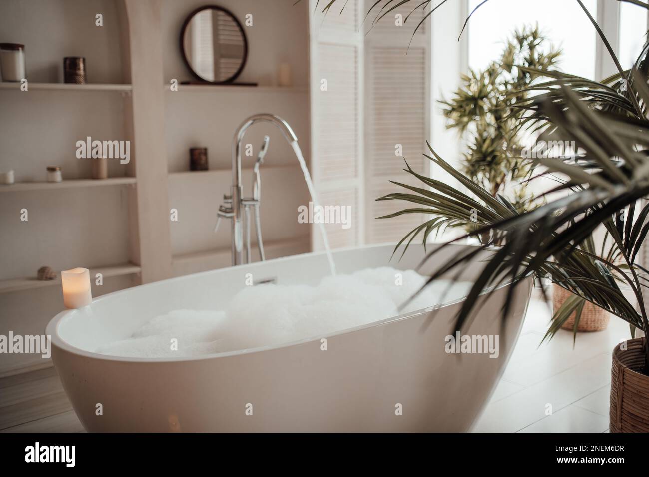 Soft native hues organic shapes look of bathroom with big window oval ...