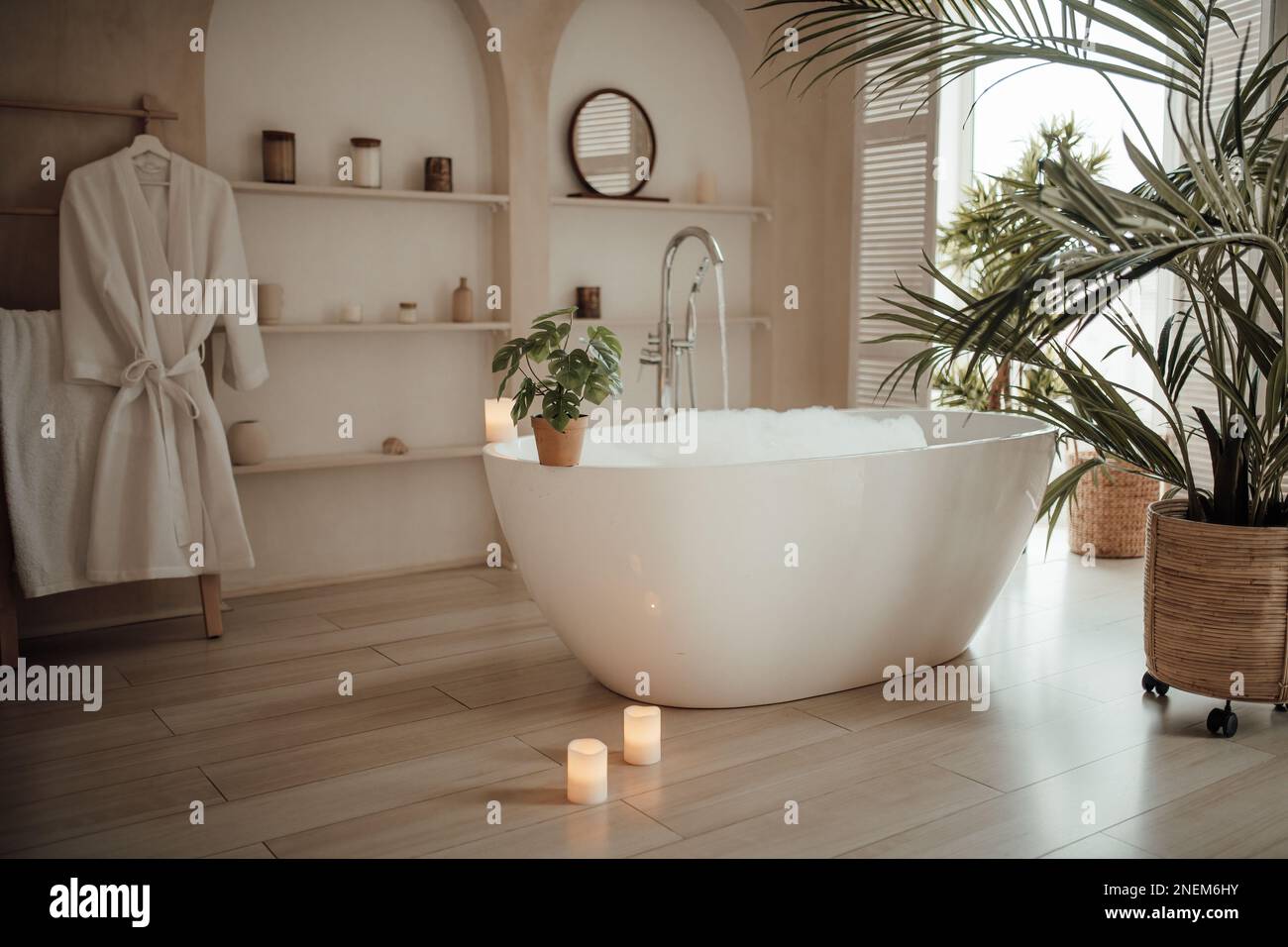 Soft native hues organic shapes look of bathroom with big window oval ...