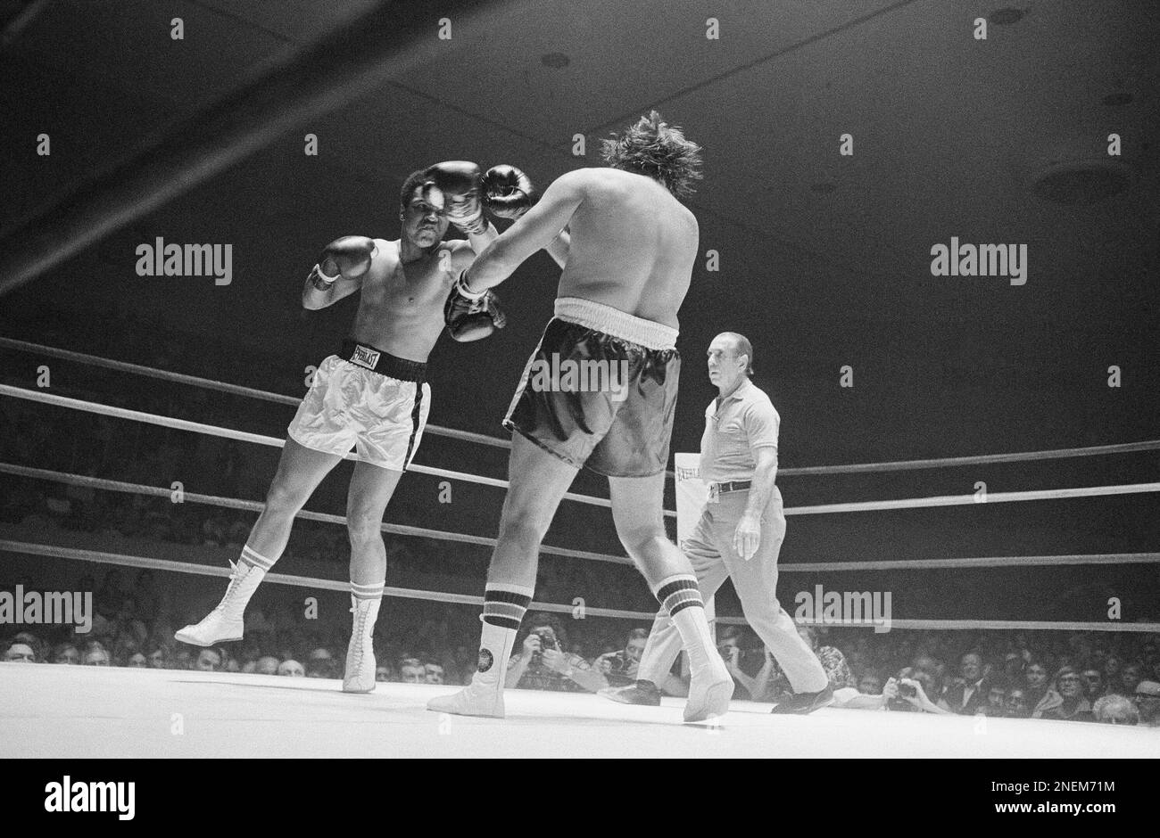 Heavyweight champion Muhammad Ali (left) goes after Rodney Bobick ...