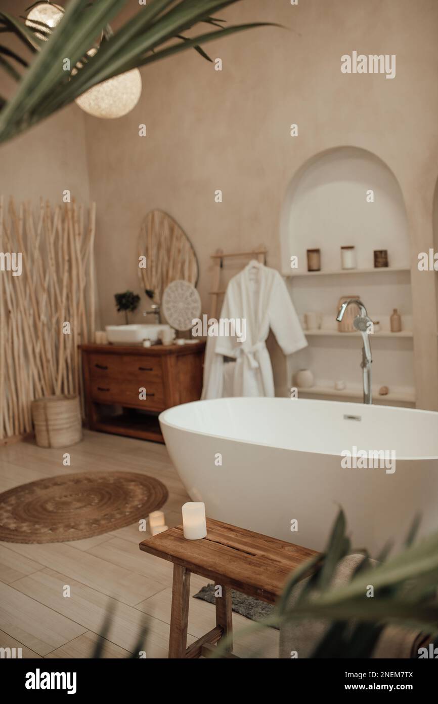 Soft native hues organic shapes look of bathroom with big window oval ...