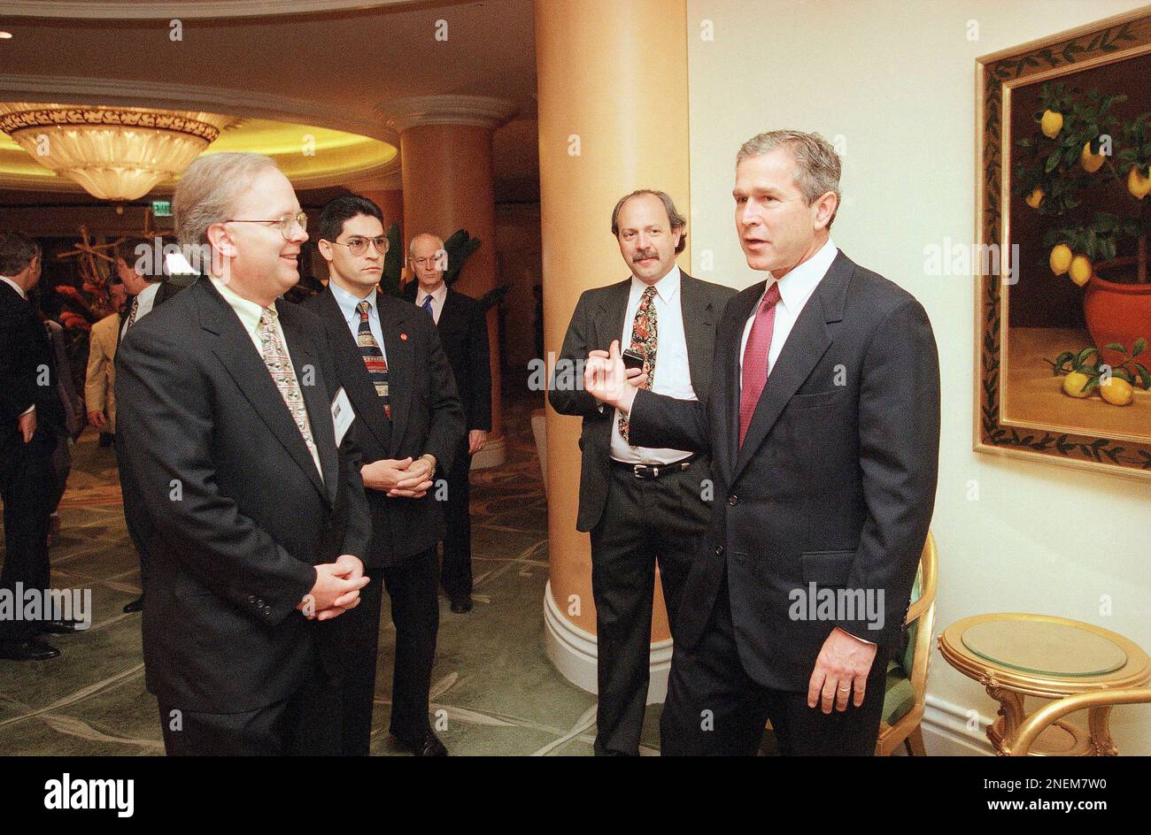 Texas Gov. George W. Bush speaks to bystanders as he enters a meeting ...