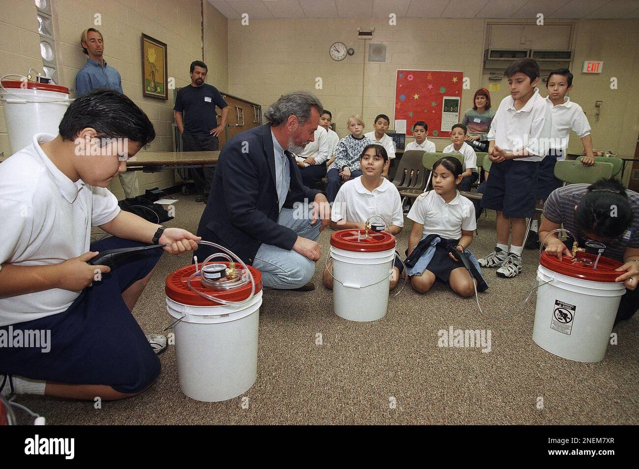 Suva Elementary School student Sergio Marmolejo, left, pumps some air ...