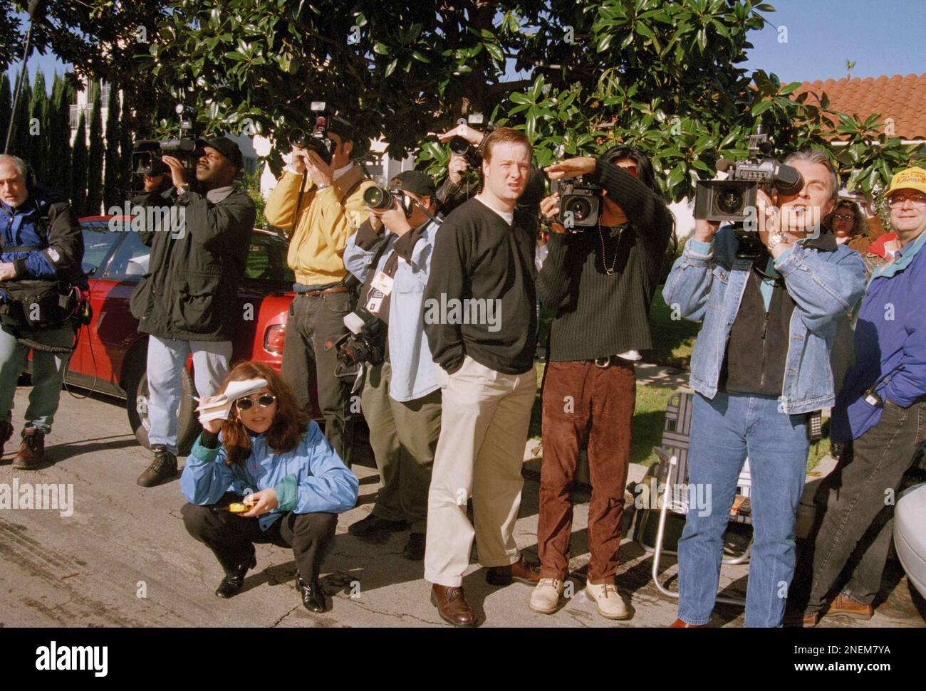 Media wait outside the Lewinsky home in the Brentwood section of Los ...