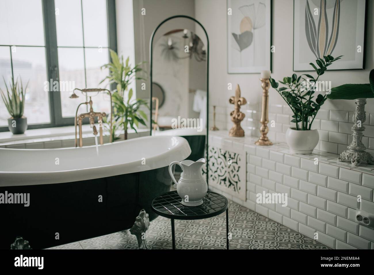Native hues organic shapes look of bathroom with big window oval bathtub in neutrals earth tones ...