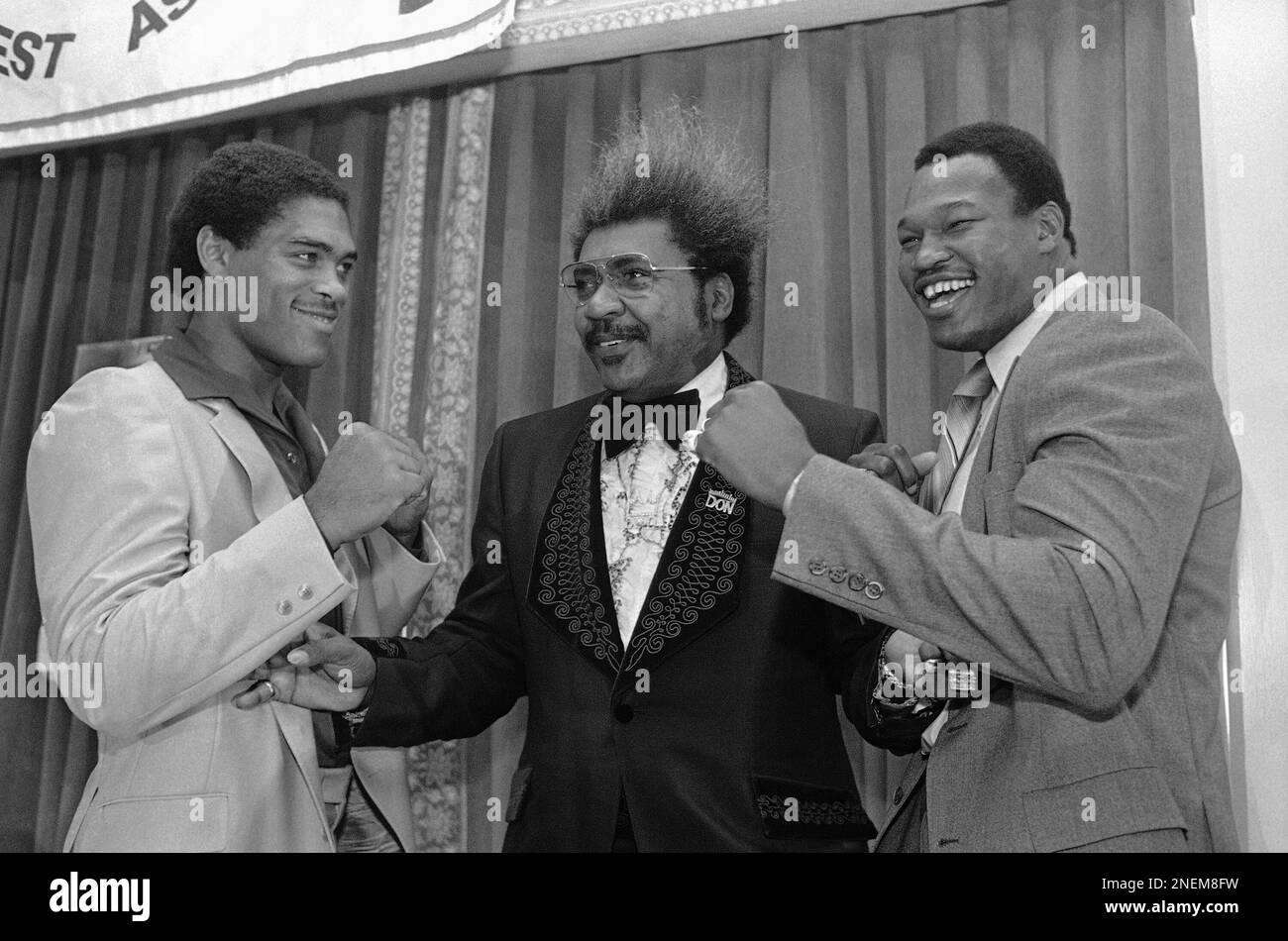 Boxing promoter Don King, center, stands between challenger Renaldo ...