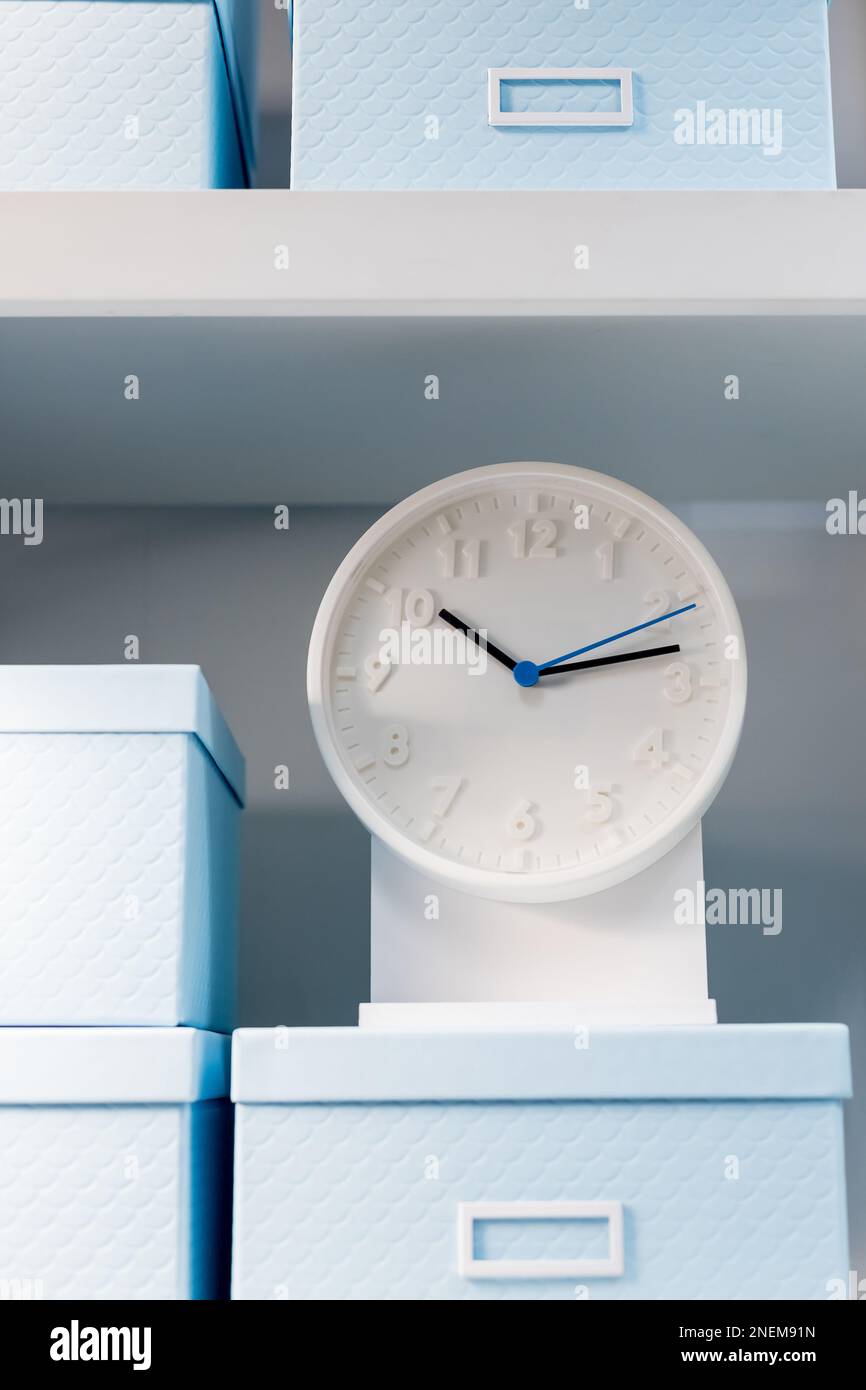 Closeup on the pointers of a clock marking ten minutes past ten. The ...