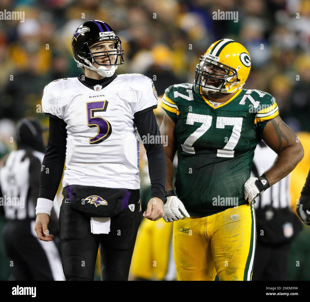 Baltimore Ravens' Joe Flacco (5) and Green Bay Packers' Cullen Jenkins ...