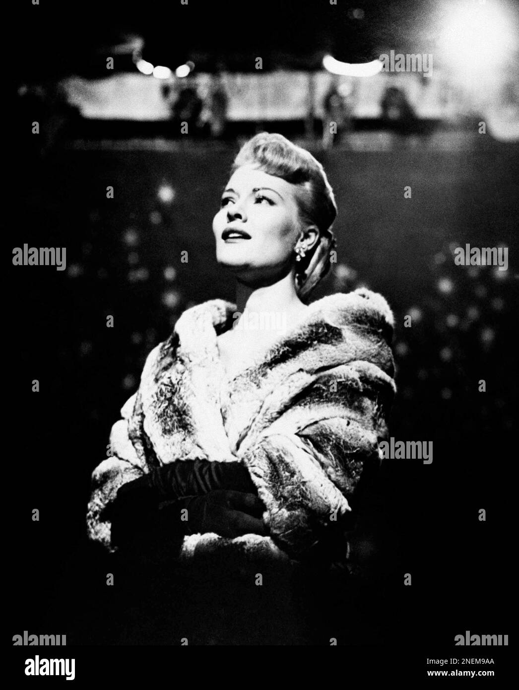 Patti Page, wrapped in furs, sings a sentimental ballad on her ...