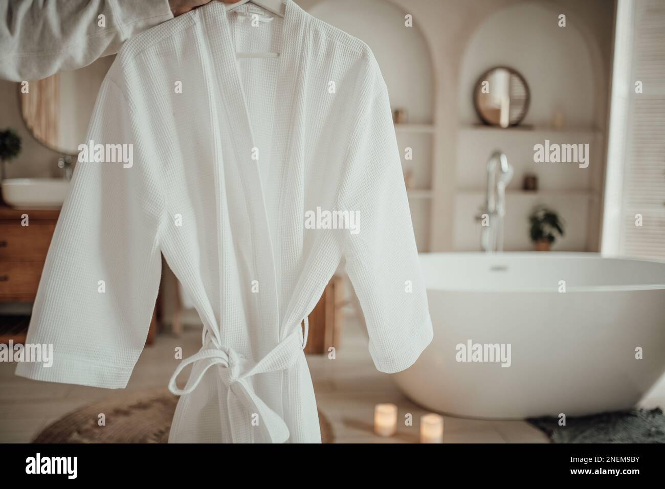 Soft native hues organic shapes look of bathroom with big window oval ...