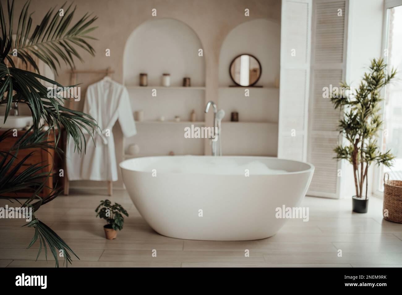 Soft native hues organic shapes look of bathroom with big window oval ...