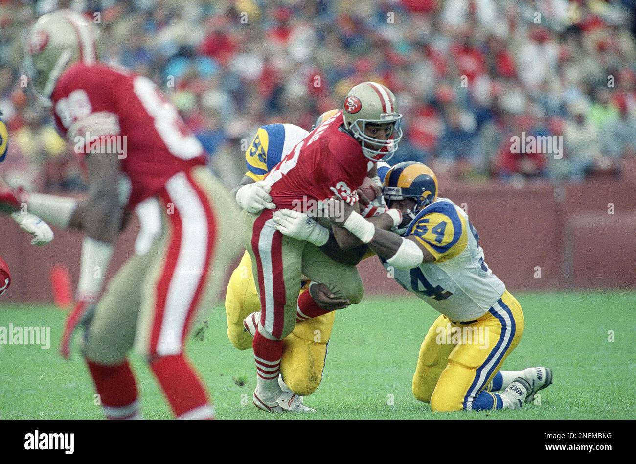 San Francisco 49ers running back Roger Craig is tackled by Los Angeles ...