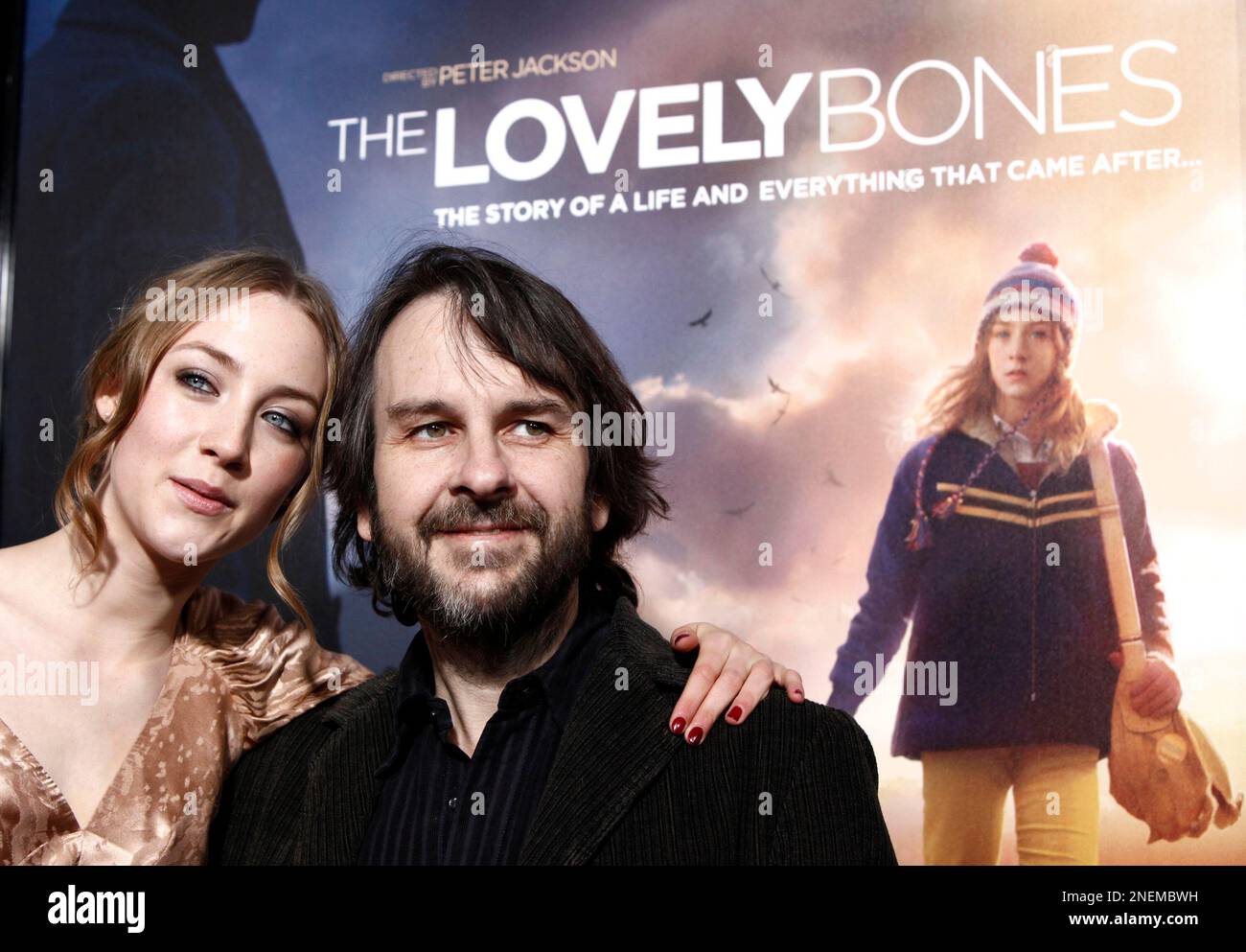 Cast member Saoirse Ronan, left, and director Peter Jackson pose ...