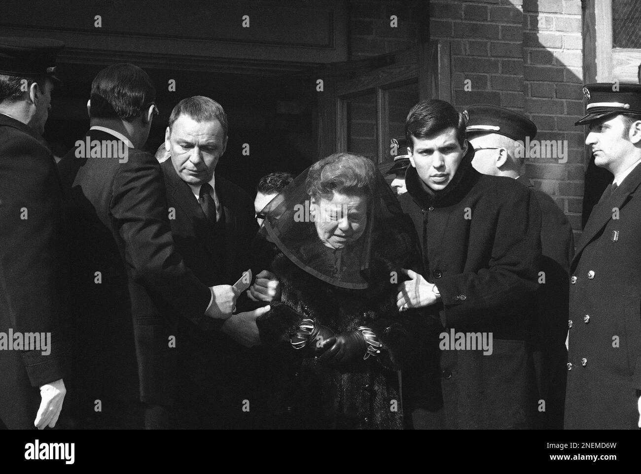 Frank Sinatra aids his mother as they leave the Madonna Church in Fort ...