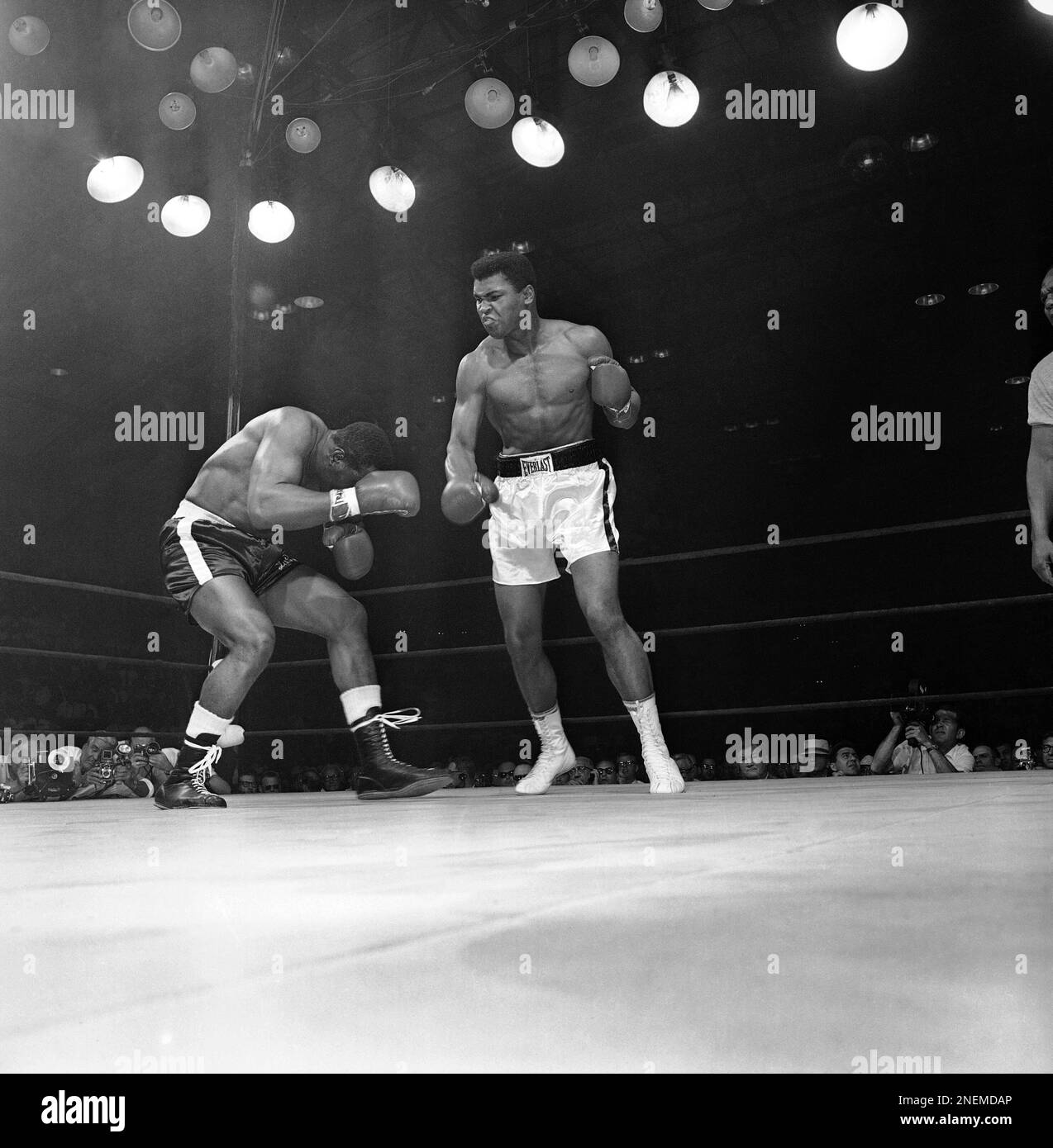 Challenger Sonny Liston ducks under a blow by heavyweight champion ...