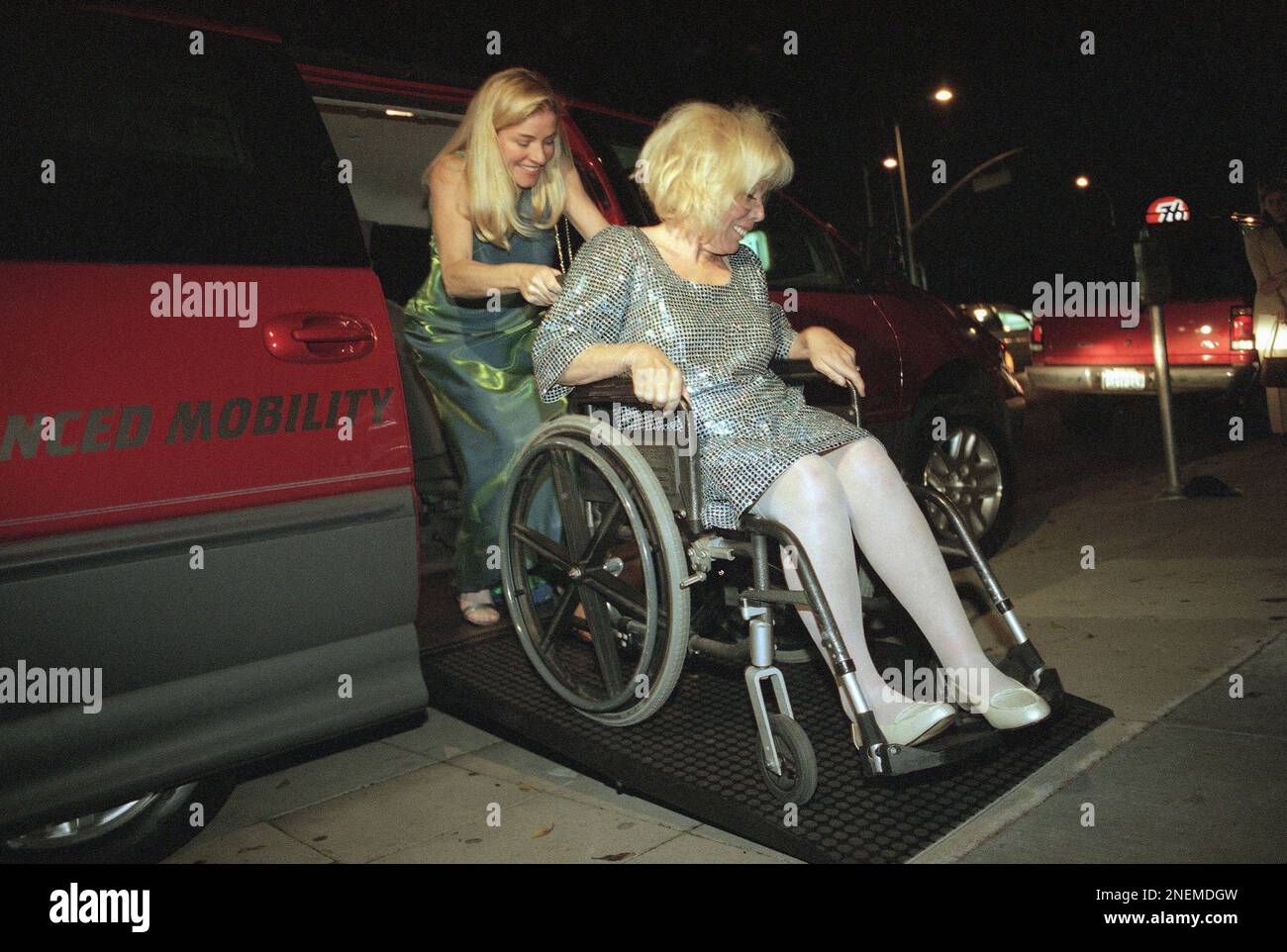 Kendall Severson pulls her mother, Ruth-Elaine Gilberti onto a van ...