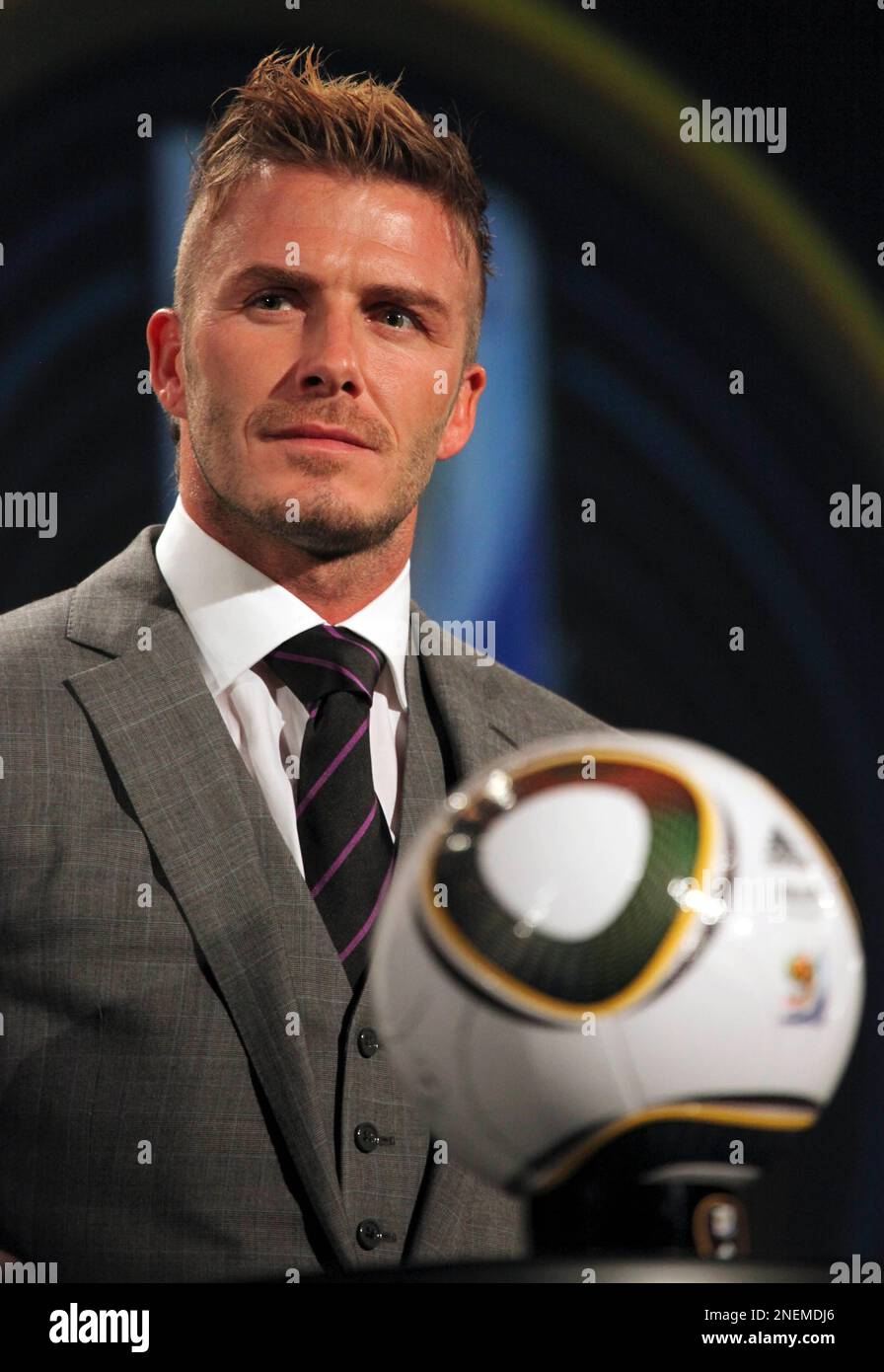 England soccer player David Beckham stands next to the official ball ...