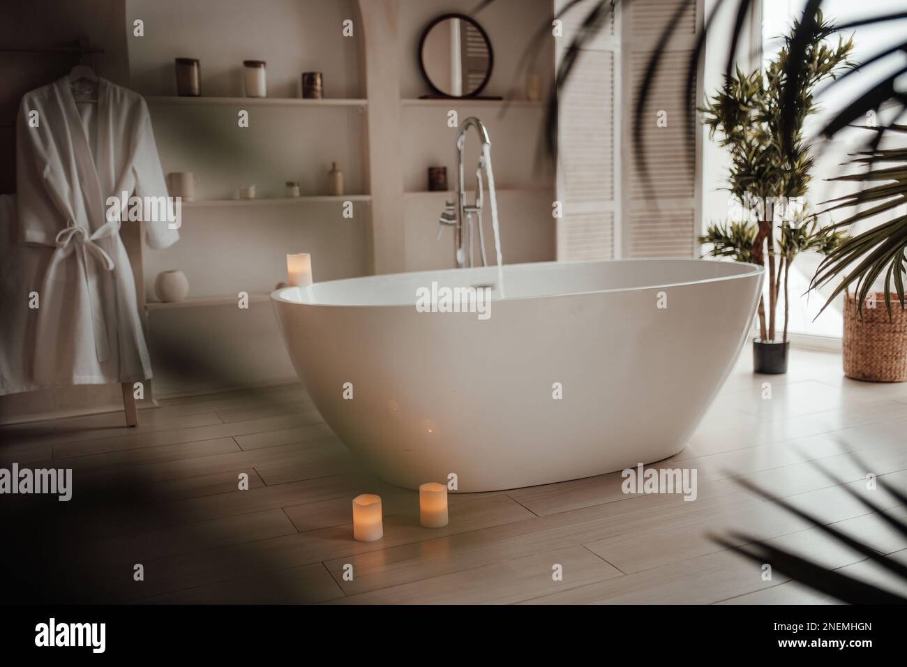 Soft native hues organic shapes look of bathroom with big window oval ...
