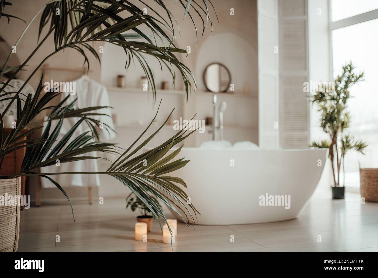 Soft native hues organic shapes look of bathroom with big window oval ...