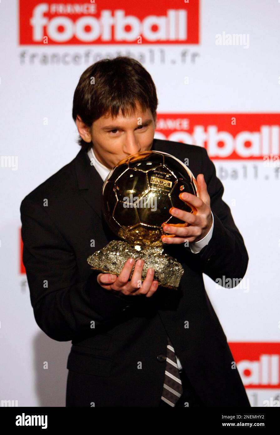 FC Barcelona's Lionel Messi, from Argentina, kisses his 'Ballon d'Or ...