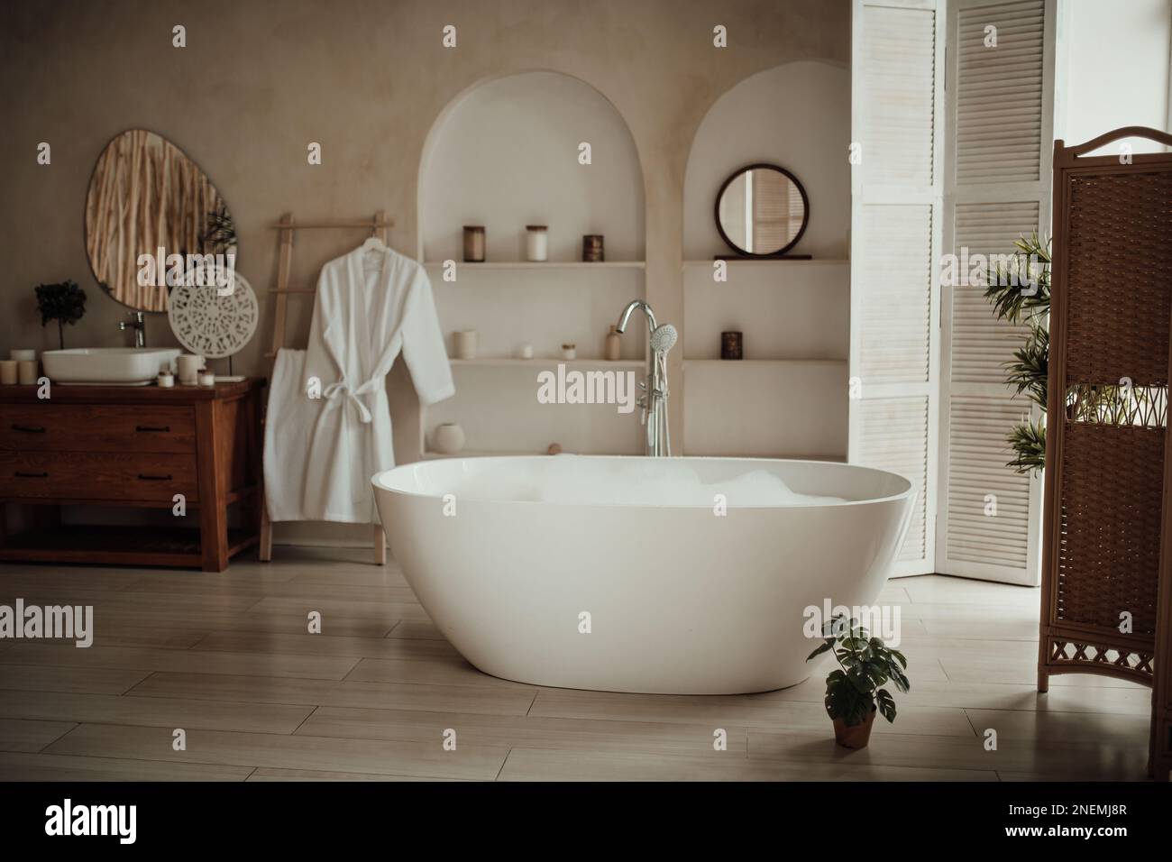 Soft native hues organic shapes look of bathroom with big window oval ...