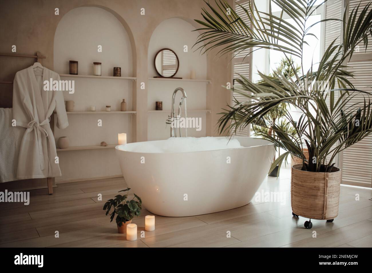 Soft native hues organic shapes look of bathroom with big window oval ...