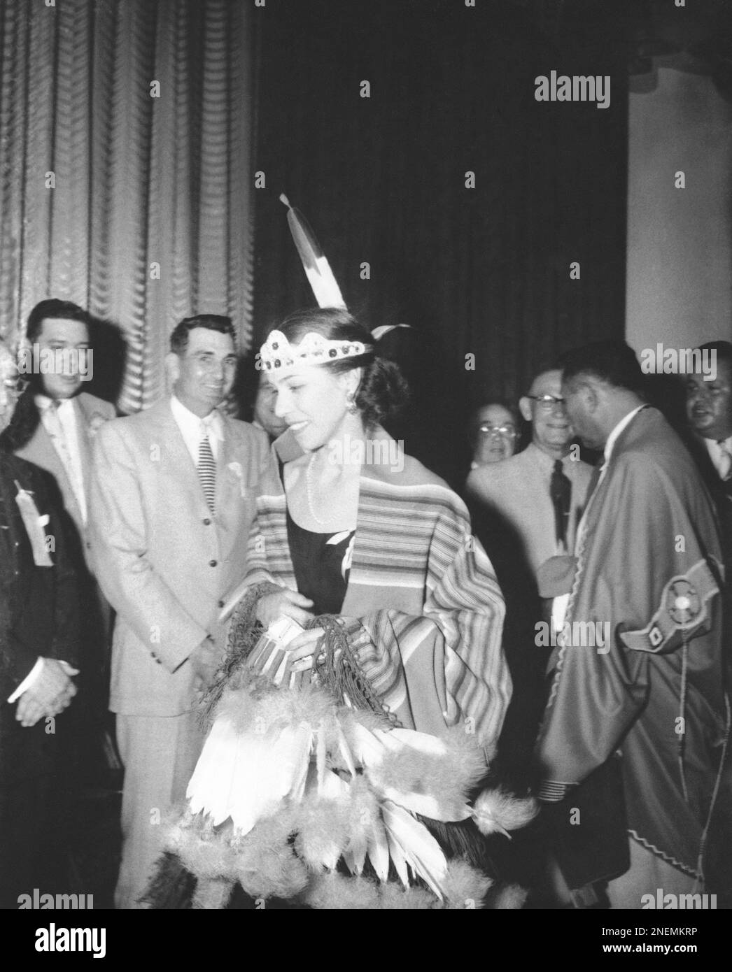 Maria Tallchief, center, in Osage tribal blanket and holding headdress ...