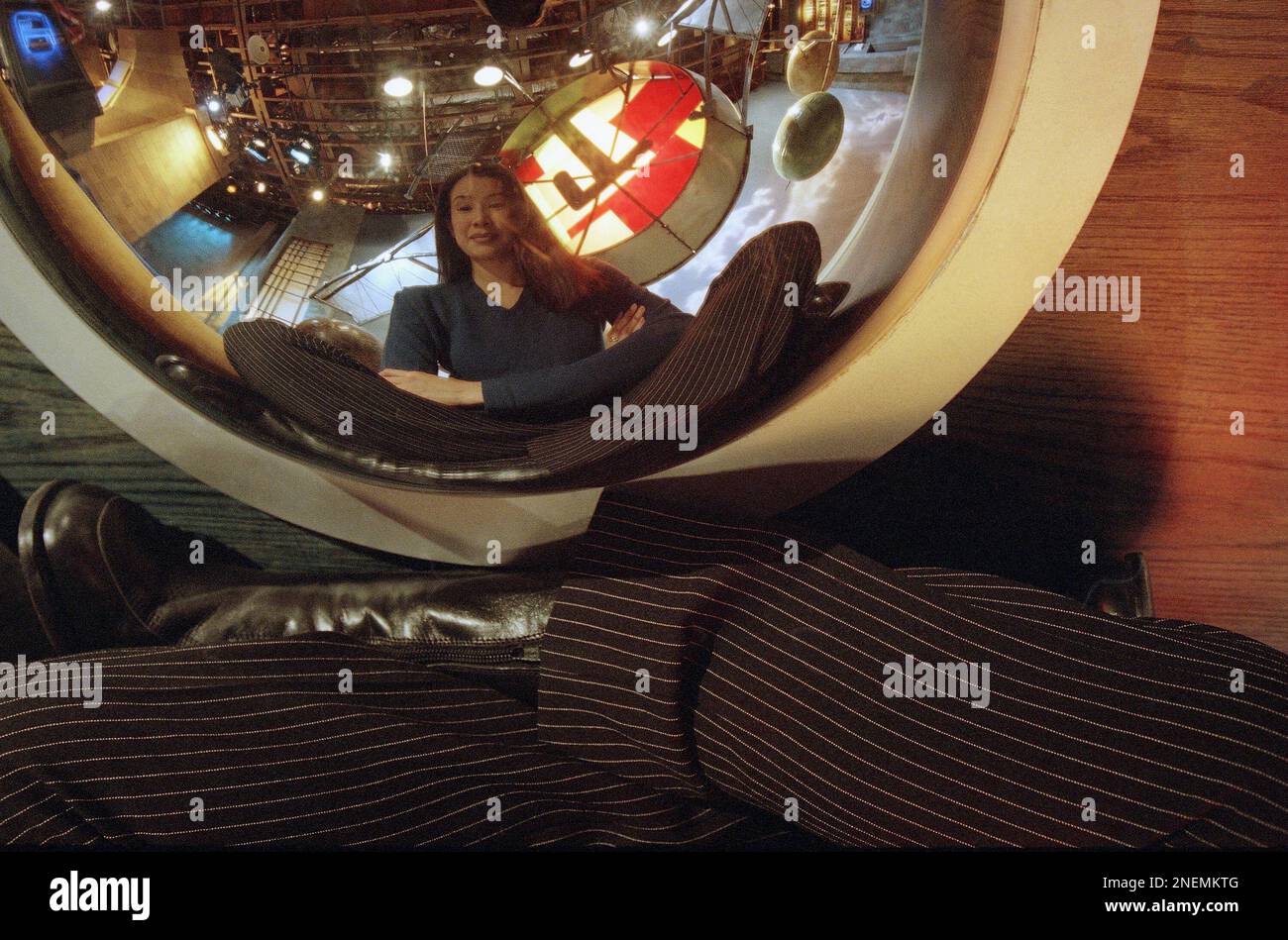 Reporter Lisa Ling, of ?Channel 1,? sits Indian style in front of a ...