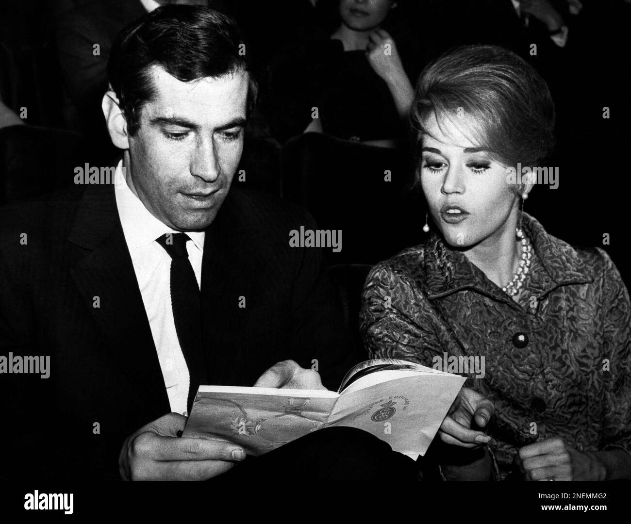 Film director Roger Vadim and actress Jane Fonda sit among the audience ...
