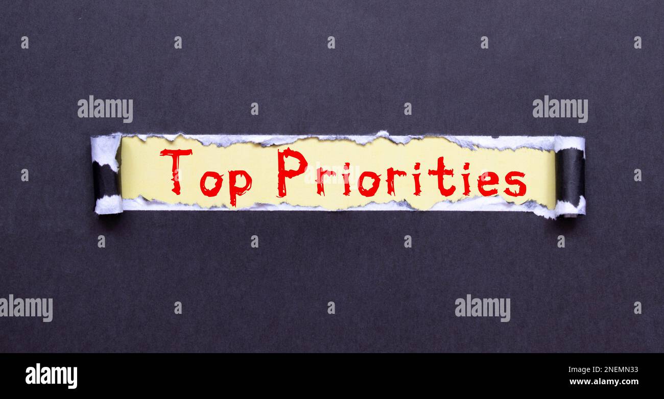 Top Priority text circled in pencil on textured paper Stock Photo - Alamy