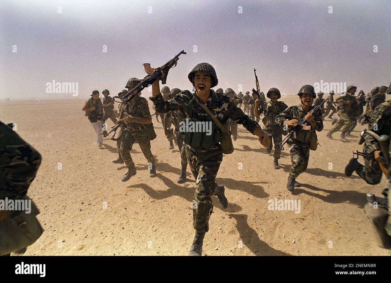 Syrian commandos charge across the desert during a training exercise in ...