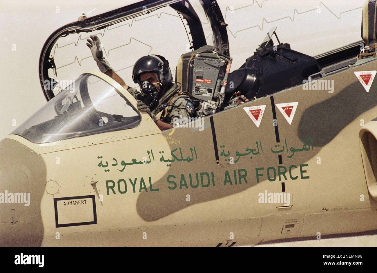 A pilot of the Royal Saudi Air Force waves to ground personnel to take ...